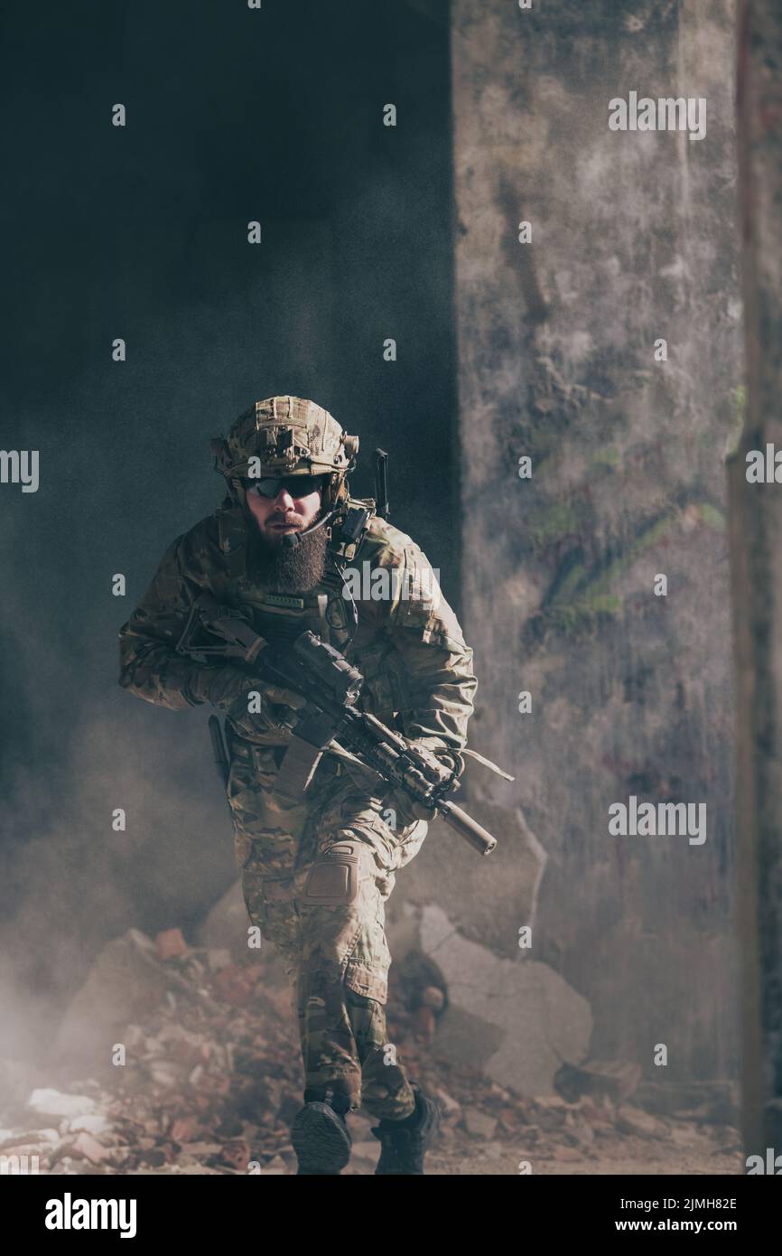 A bearded soldier in uniform of special forces in a dangerous military ...