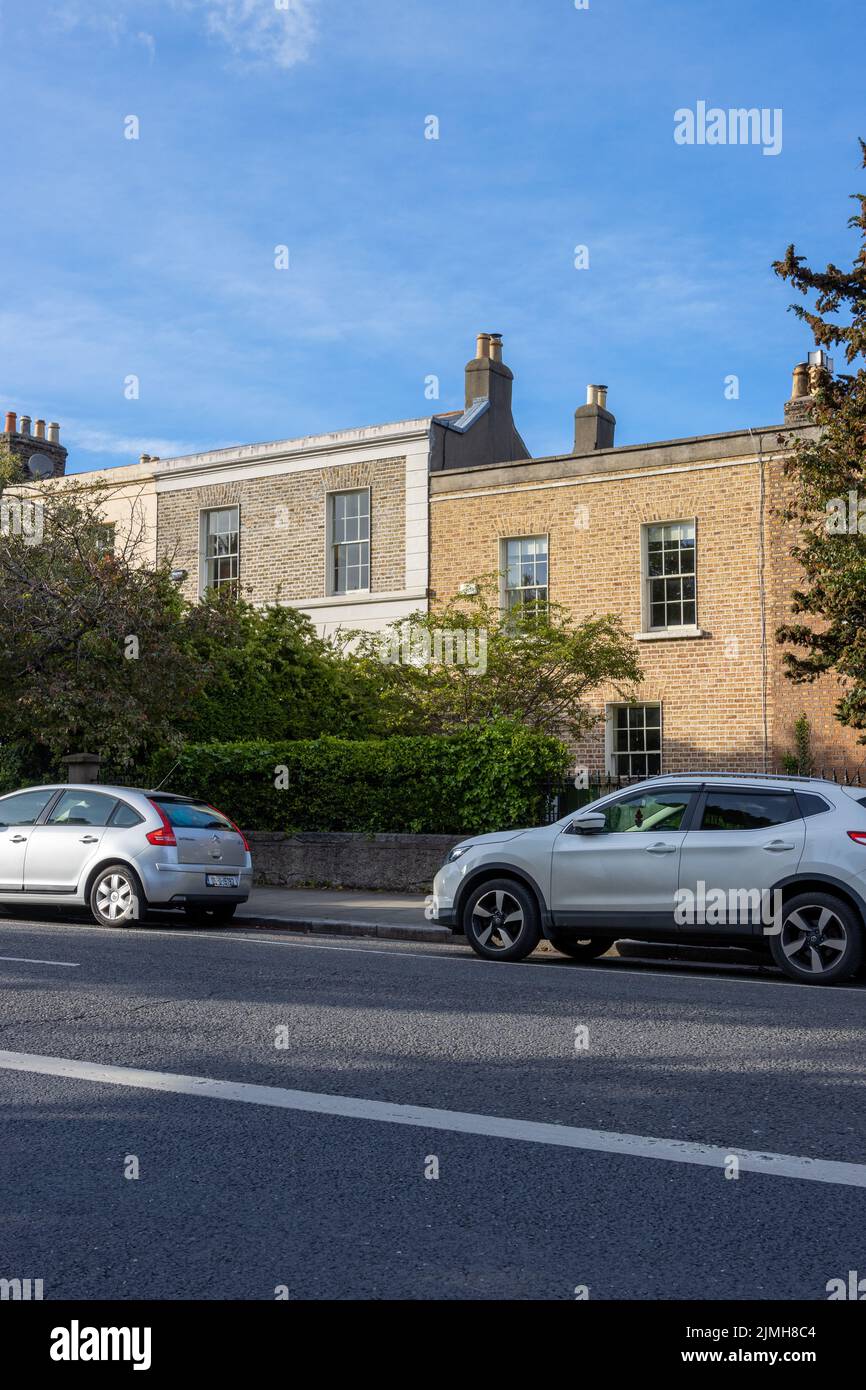 A vertical shot of a brick building in Dublin Ireland in a neighborhood ...