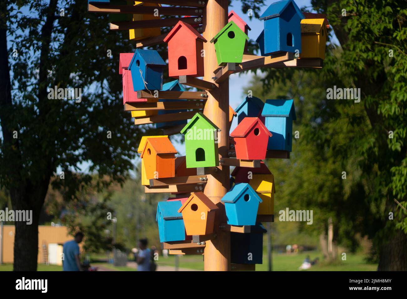 Houses for birds. Colored wooden houses. An element in the park. Art ...