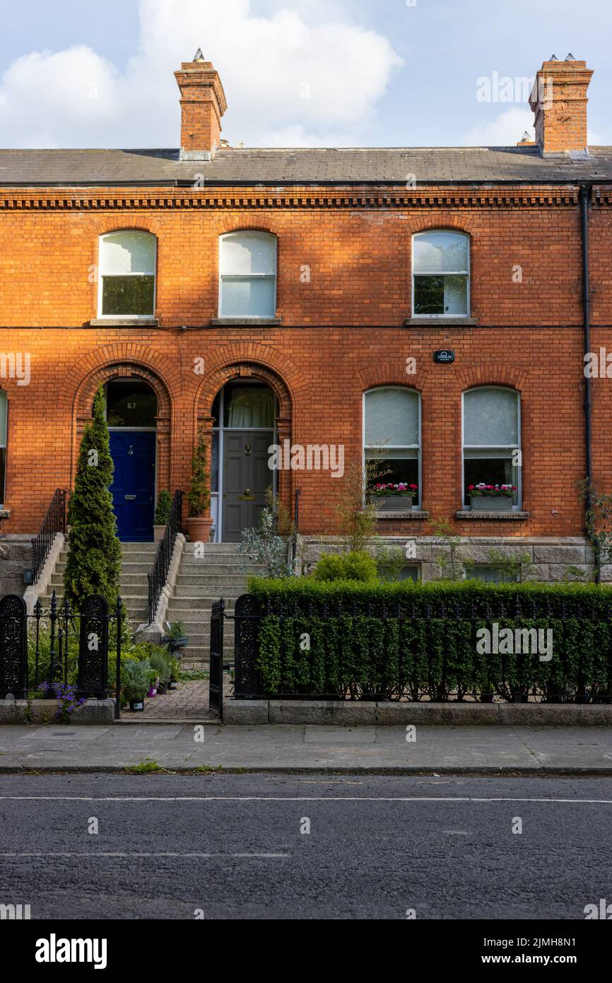 A vertical shot of a brick building in Dublin Ireland in a neighborhood ...