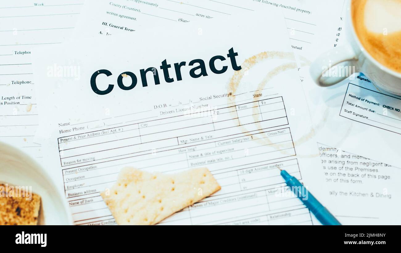 messy manager workplace stained contract papers Stock Photo - Alamy