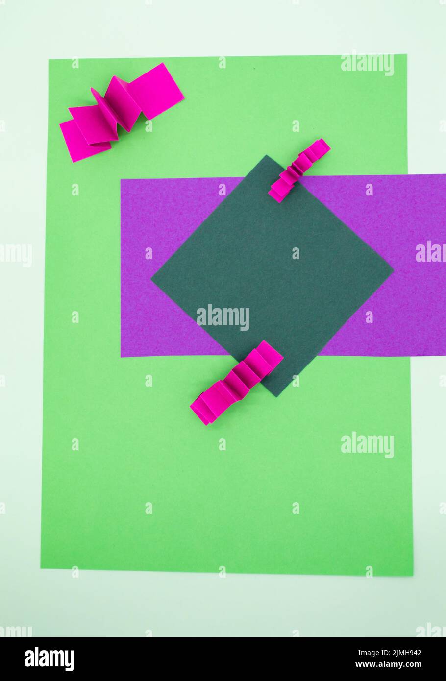 Abstract background in green, pink and purple colors with 3D paper ...