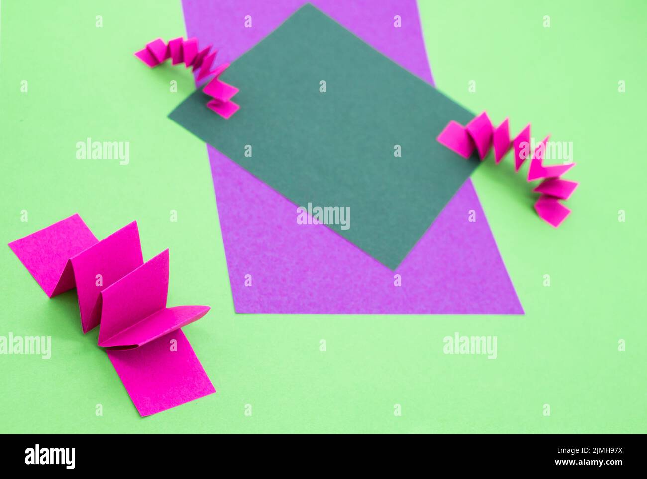 Abstract background in green, pink and purple colors with 3D paper ...