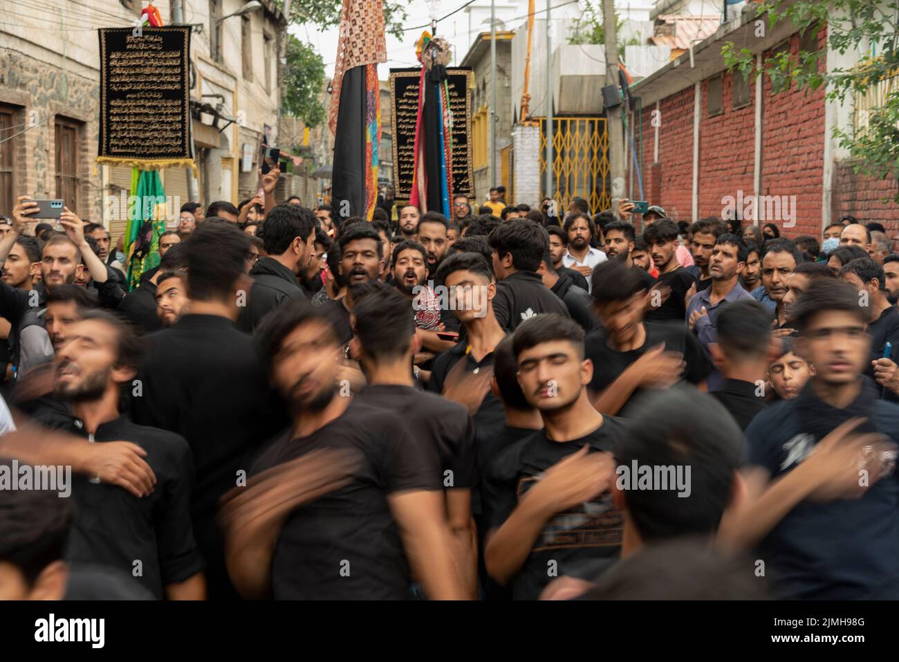 Shia Muslim mourners beat their chests during a religious procession on ...
