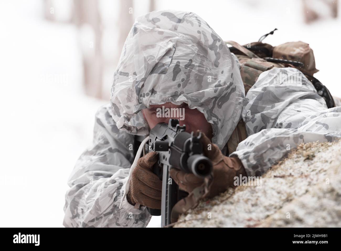 Soldier in winter camouflaged uniform in Modern warfare army on a snow ...
