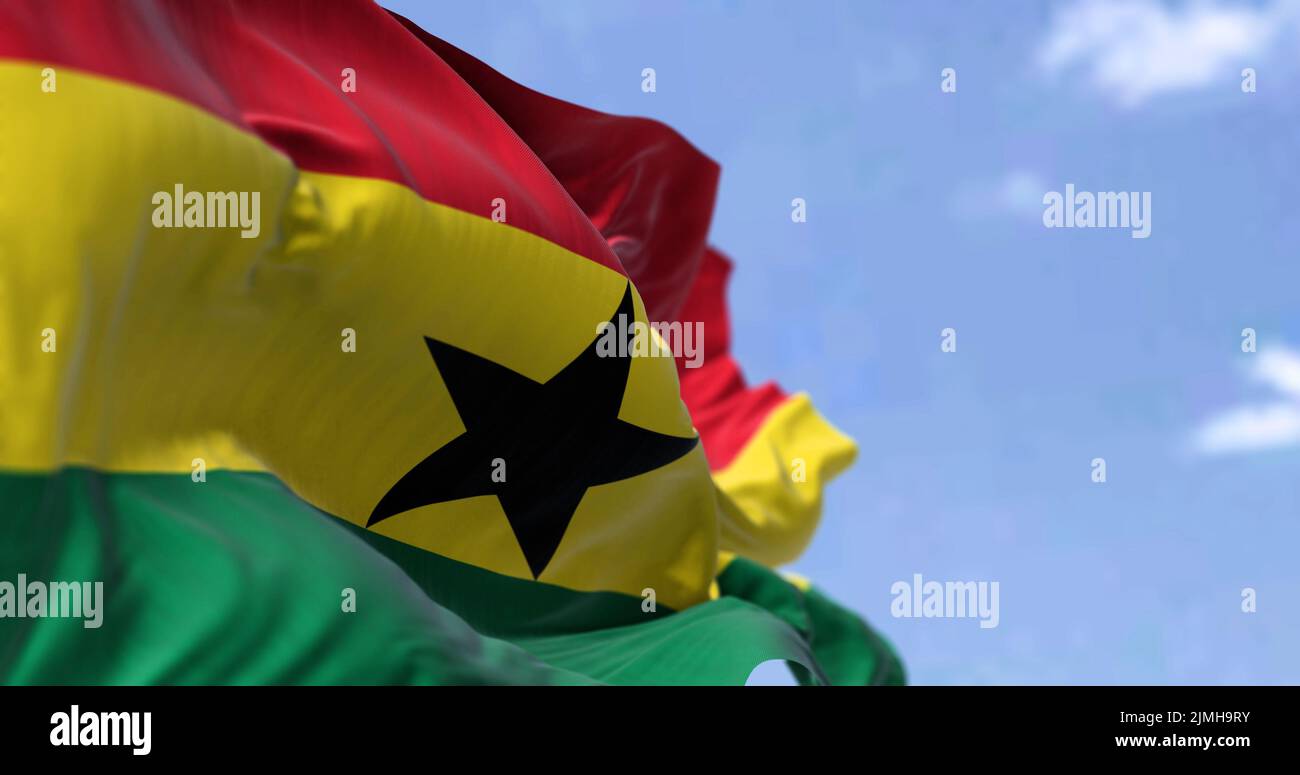 Detail of the national flag of Ghana waving in the wind on a clear day ...