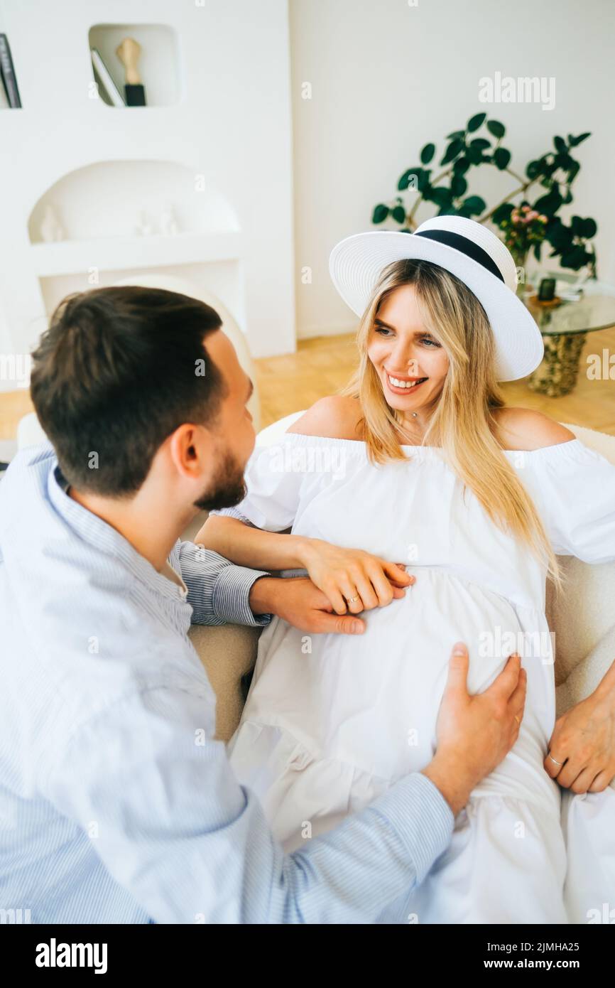 Future mother and father clasped pregnant big tummy. husband hugs ...