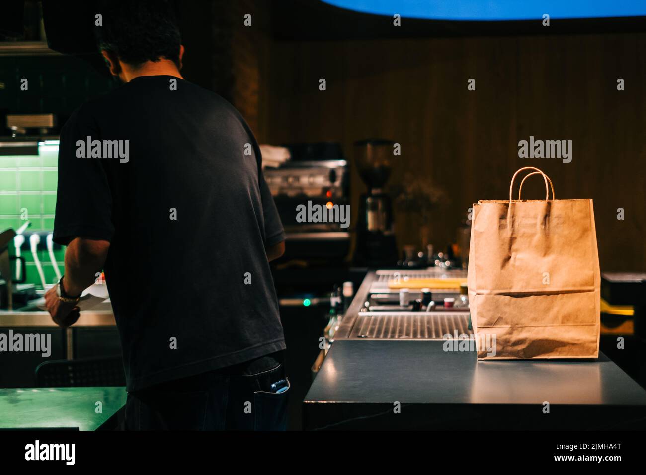 Paper eco bag with food in a restaurant station waiting for courier ...