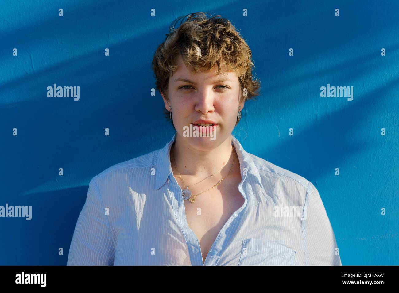 A portrait of a brave chubby Caucasian woman who fought cancer posing ...
