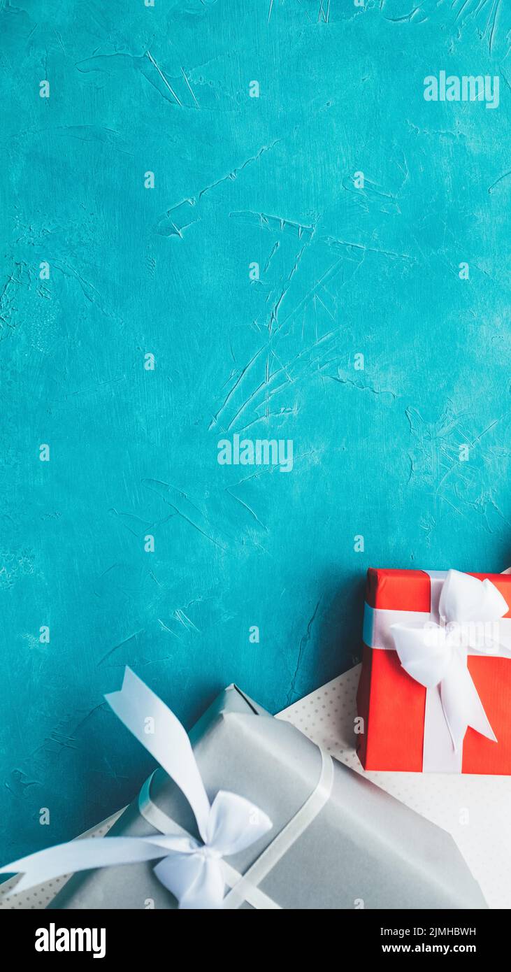holiday surprise gift boxes aqua blue background Stock Photo - Alamy