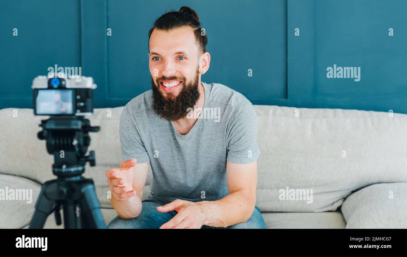 social media influencer smiling man shoot video Stock Photo - Alamy