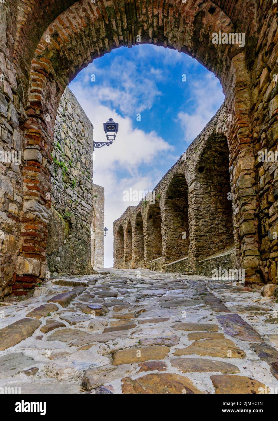 Castle gate and walls in the historic city center of Castello de ...