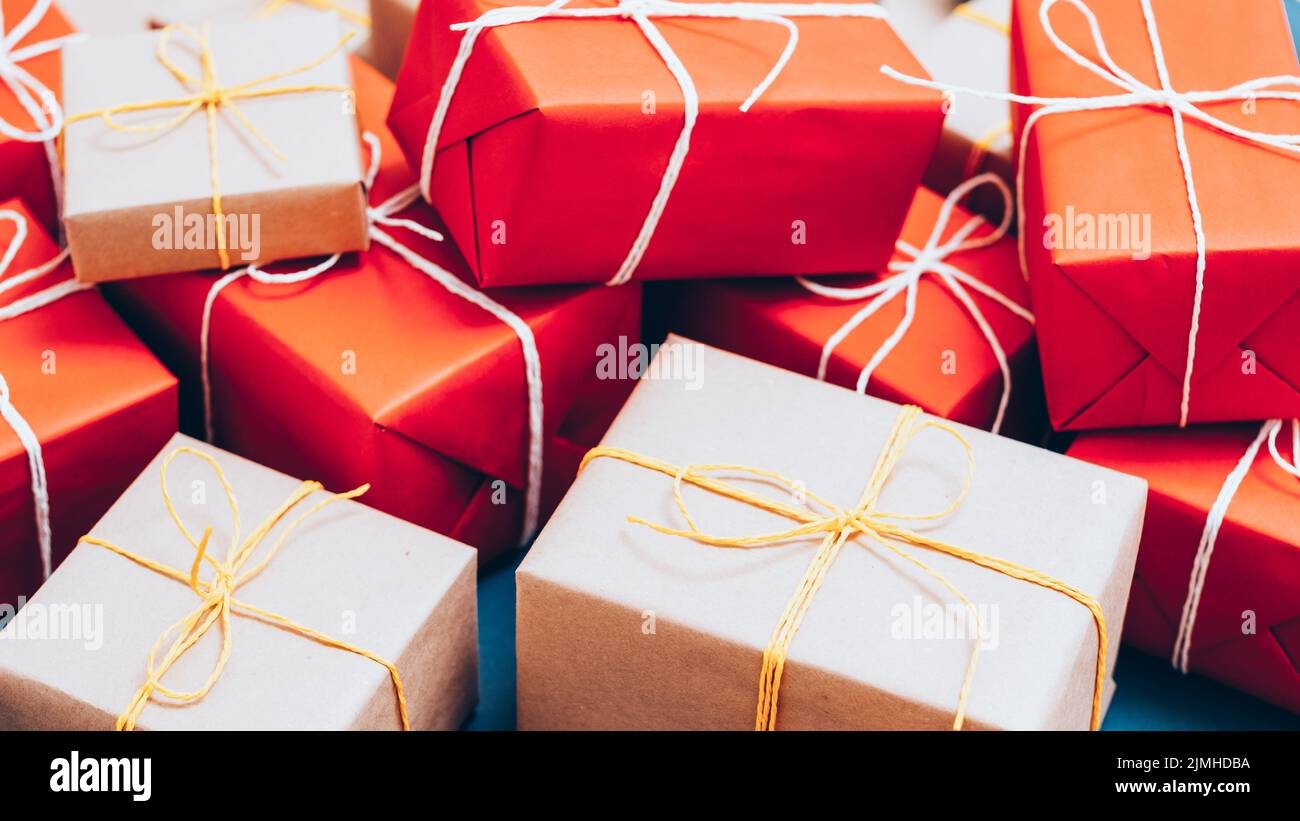 holidays shopping beige red gift boxes stack Stock Photo - Alamy