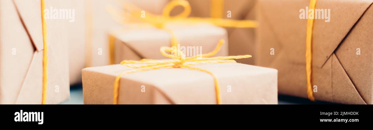 handmade gift packaging beige boxes yellow cord Stock Photo - Alamy