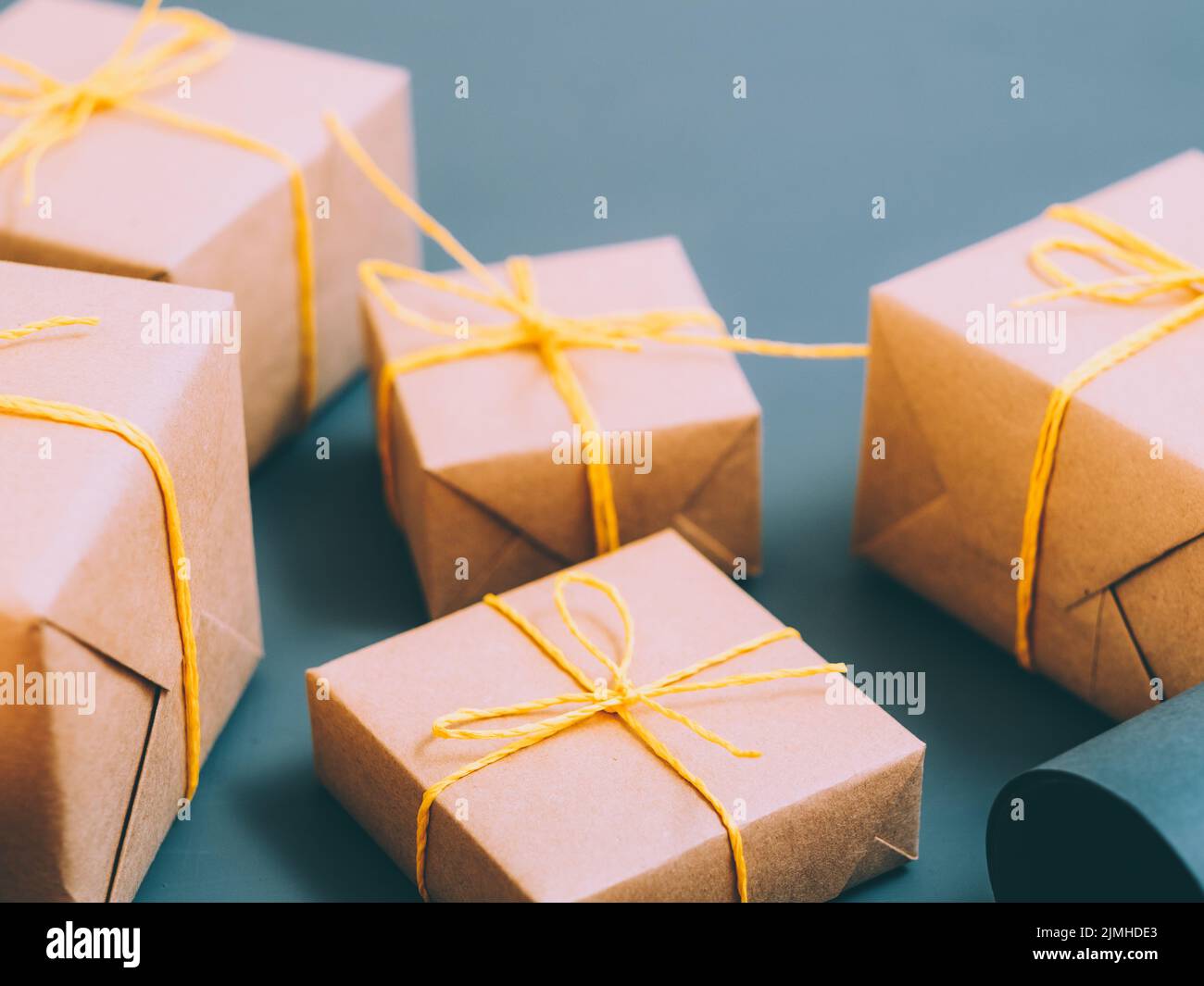 online shopping beige paper gift boxes steel blue Stock Photo - Alamy