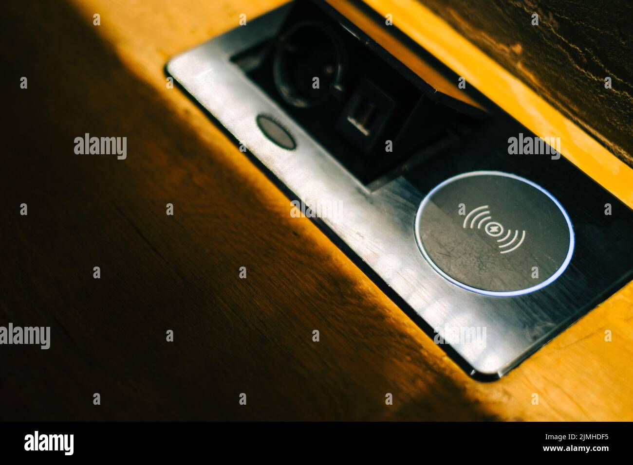 Wireless charger and usb connectors in the restaurant Stock Photo - Alamy
