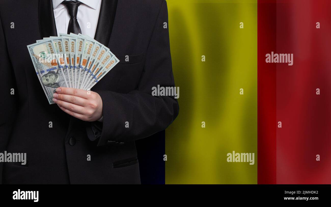 Male model showing 100 US dollar bills money banknotes against Romanian ...