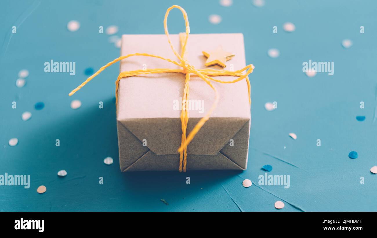 holiday surprise beige paper gift box teal blue Stock Photo - Alamy