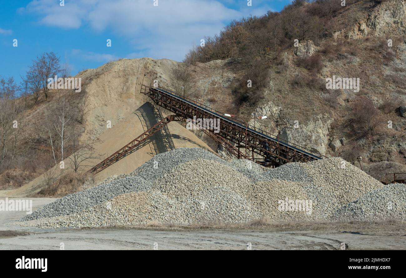 Conveyor belt at an old gravel quarry. Mining and quarrying equipment ...