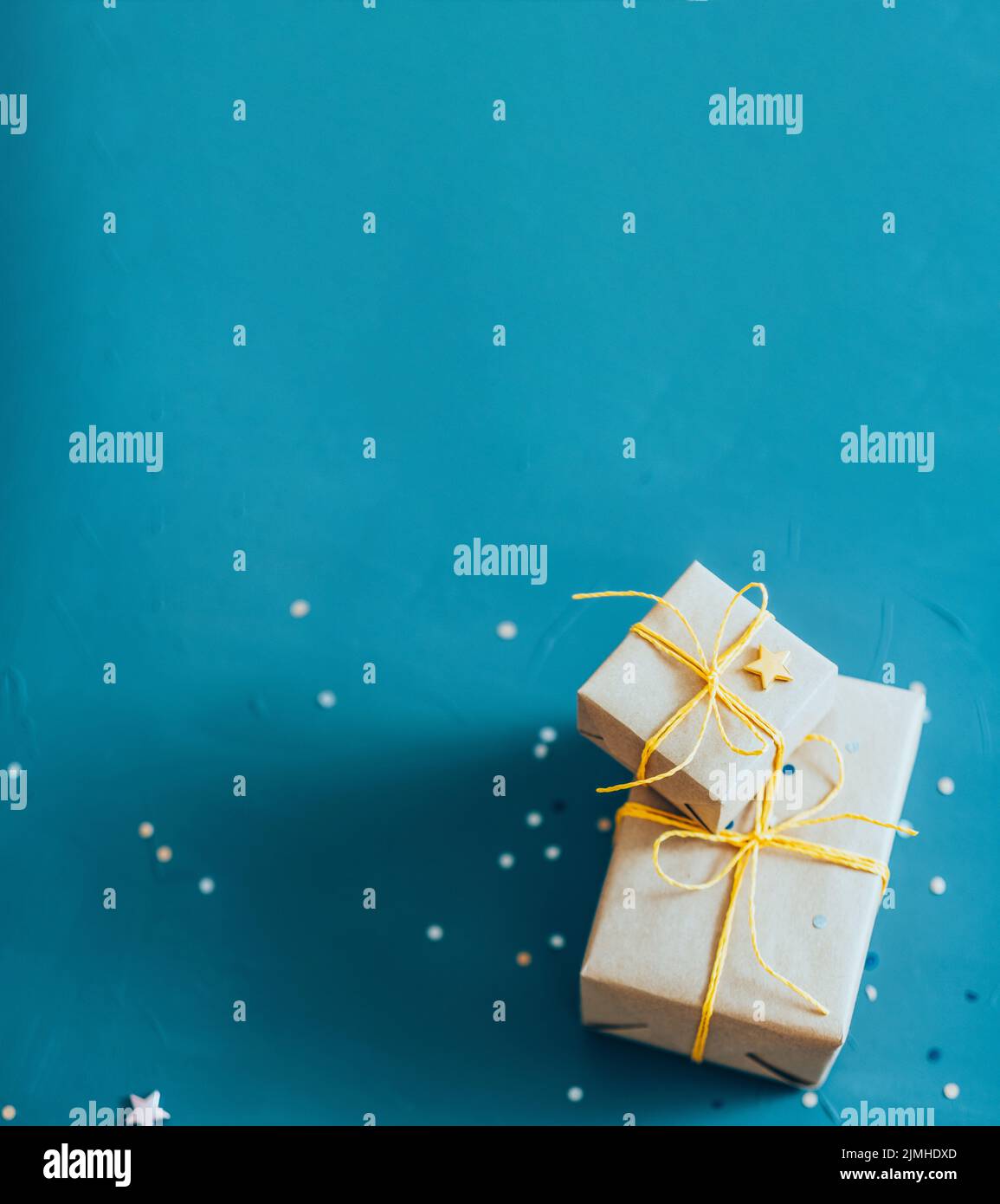 holiday surprise beige paper gift boxes teal blue Stock Photo - Alamy