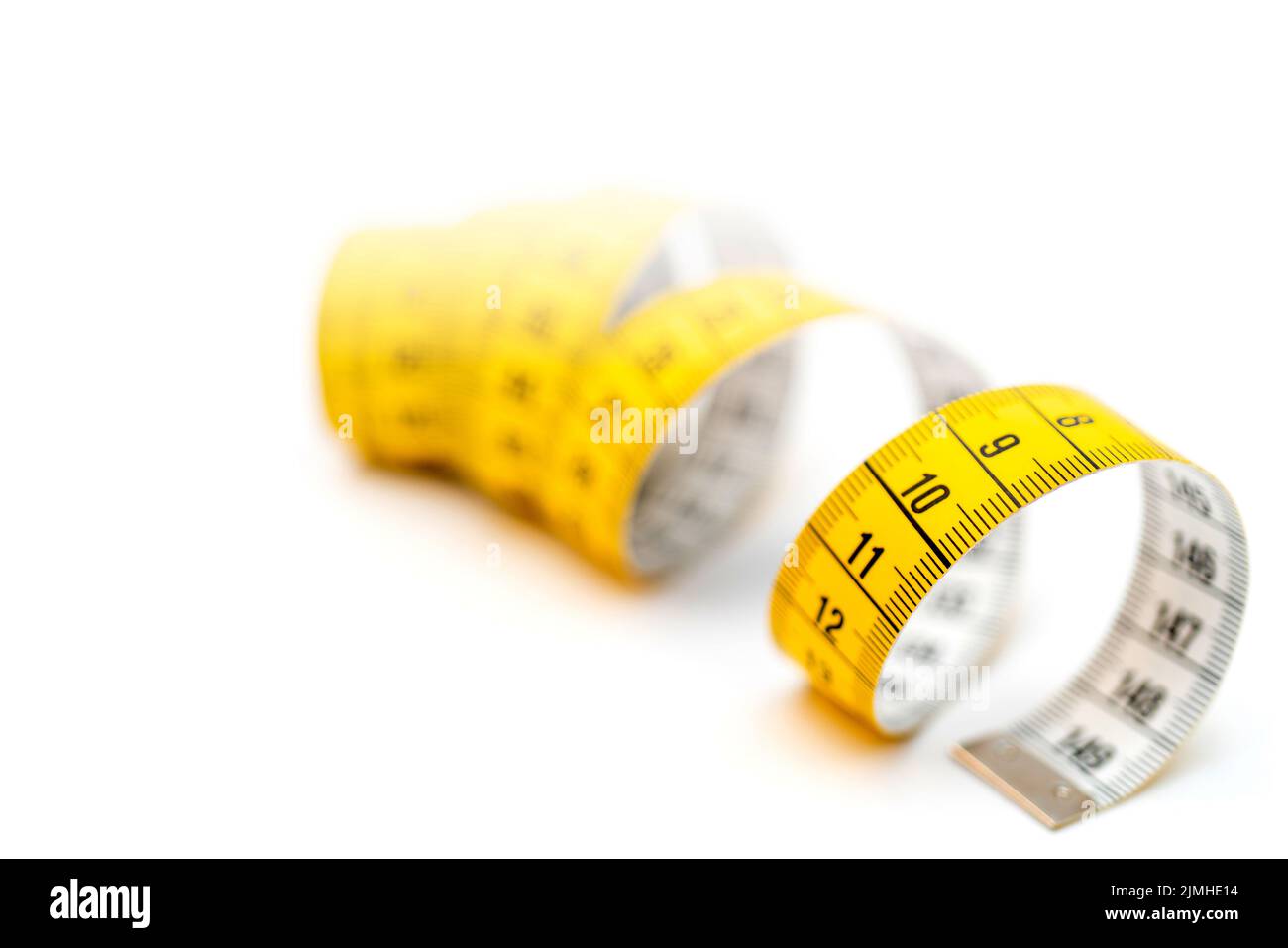 Yellow measuring tape on white background. Measurement of length and ...