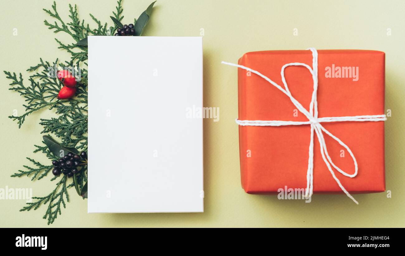 greeting set white paper orange gift box juniper Stock Photo - Alamy