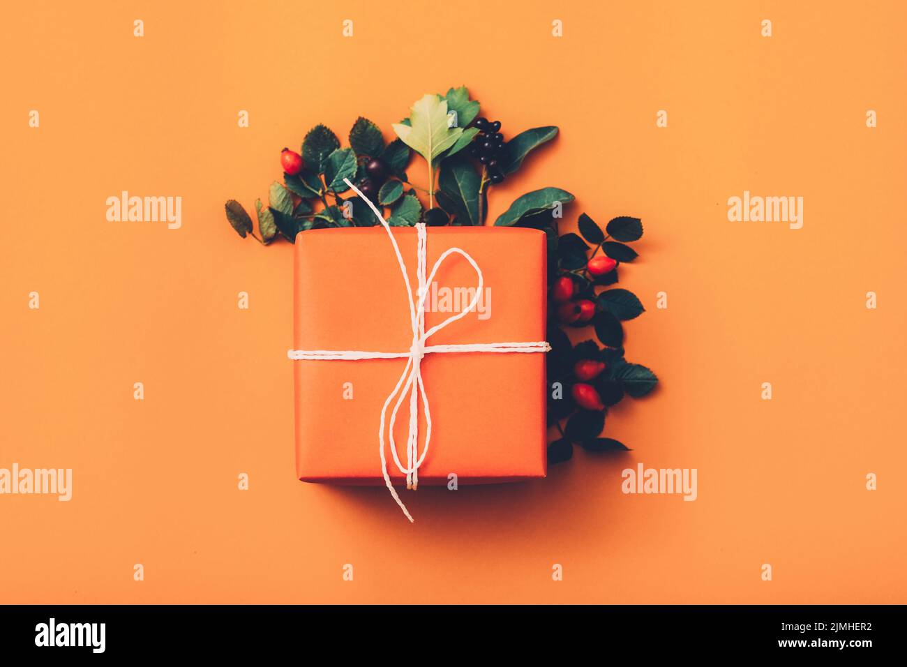 birthday handmade gift box orange background Stock Photo - Alamy