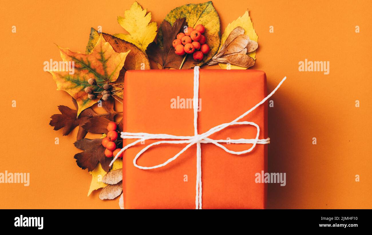floral art craft red gift box orange background Stock Photo - Alamy