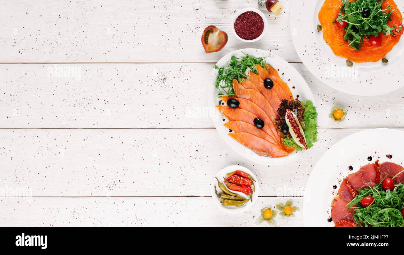 sea food snacks sliced fish assortment appetizers Stock Photo - Alamy