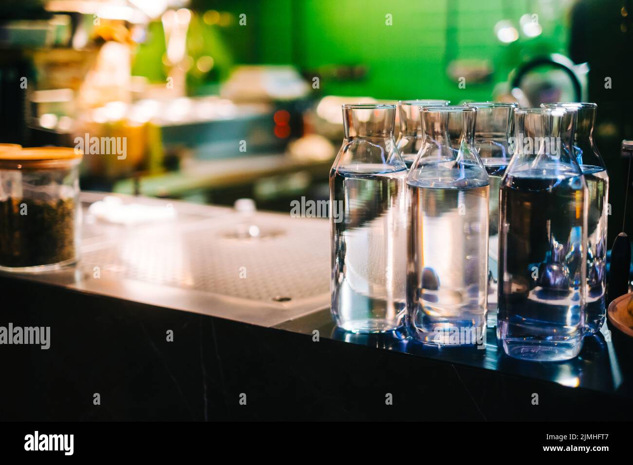 Glass bottles with water on the bar counter in asian restaurant Stock ...