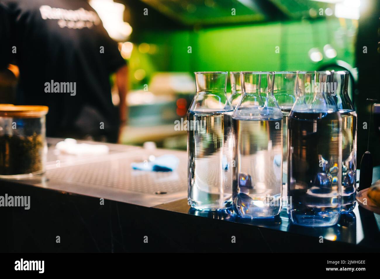 Glass bottles with water on the bar counter in asian restaurant Stock ...