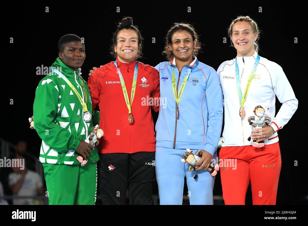Canada's Justina di Stasio (second left) celebrates winning the gold in ...