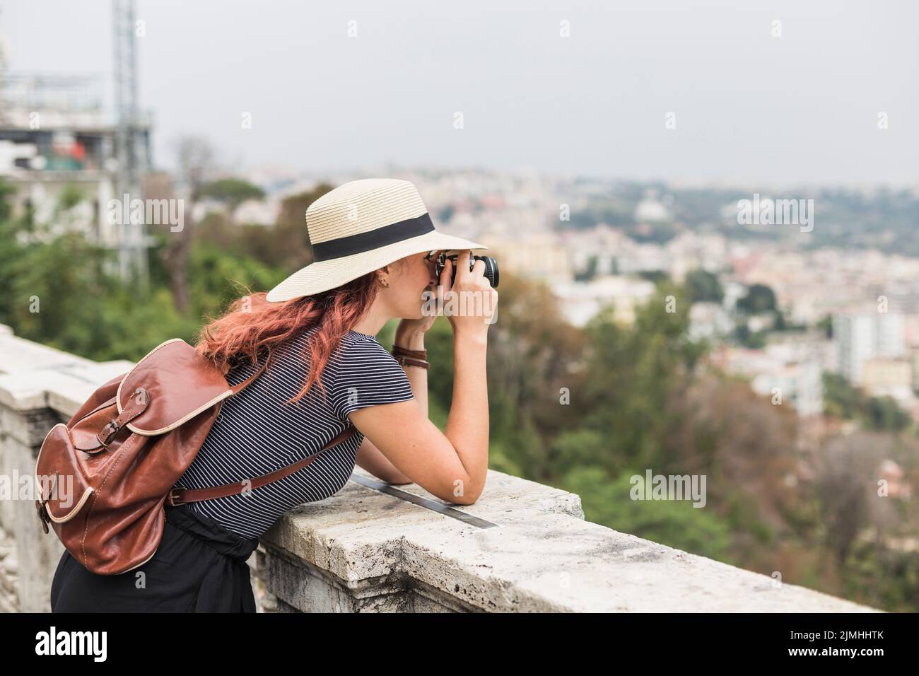 Female tourist with camera balcony Stock Photo - Alamy