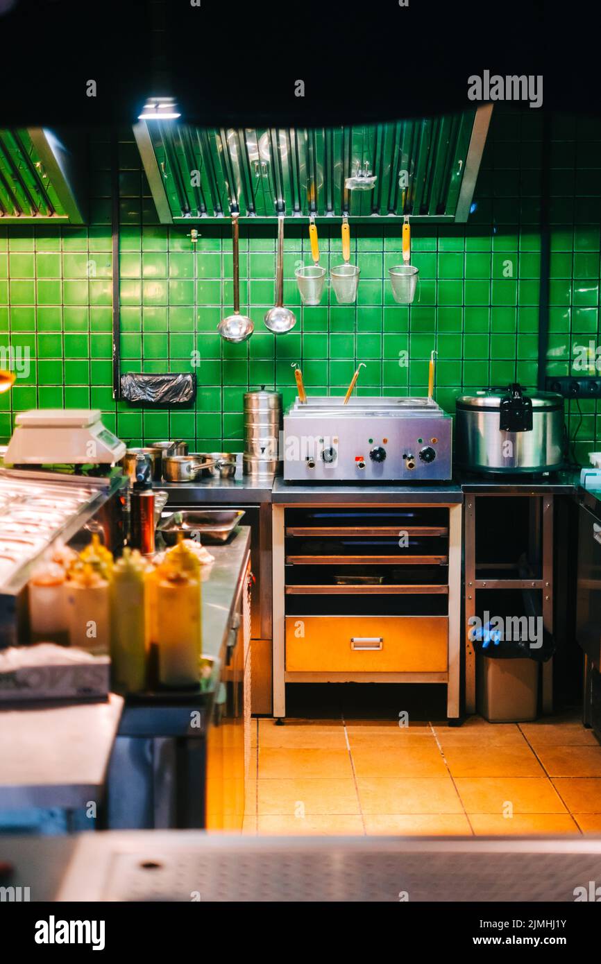 Kitchen table with professional equipment in a public cafe Stock Photo ...