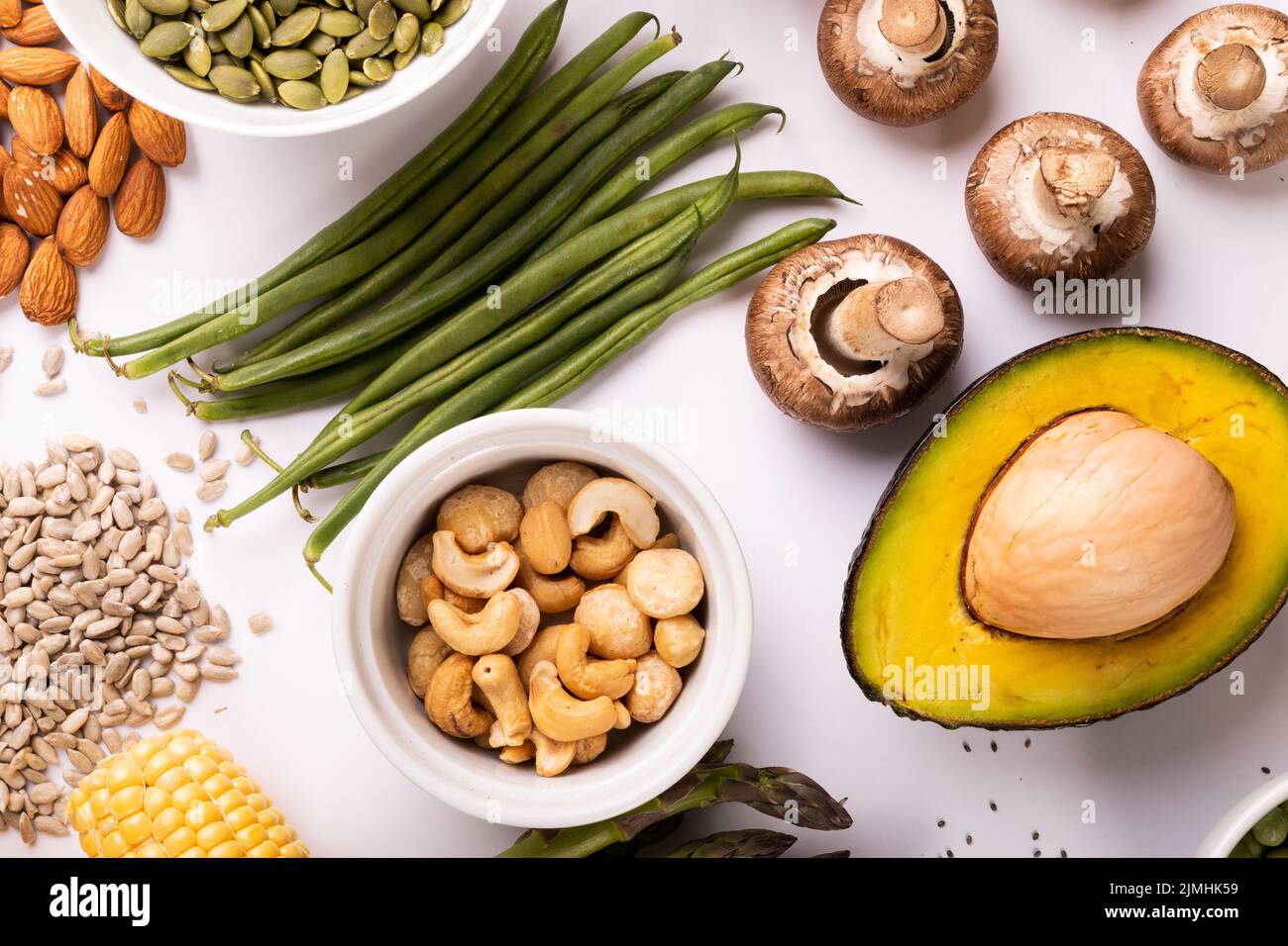High angle view of healthy food and ingredients arranged on white table ...