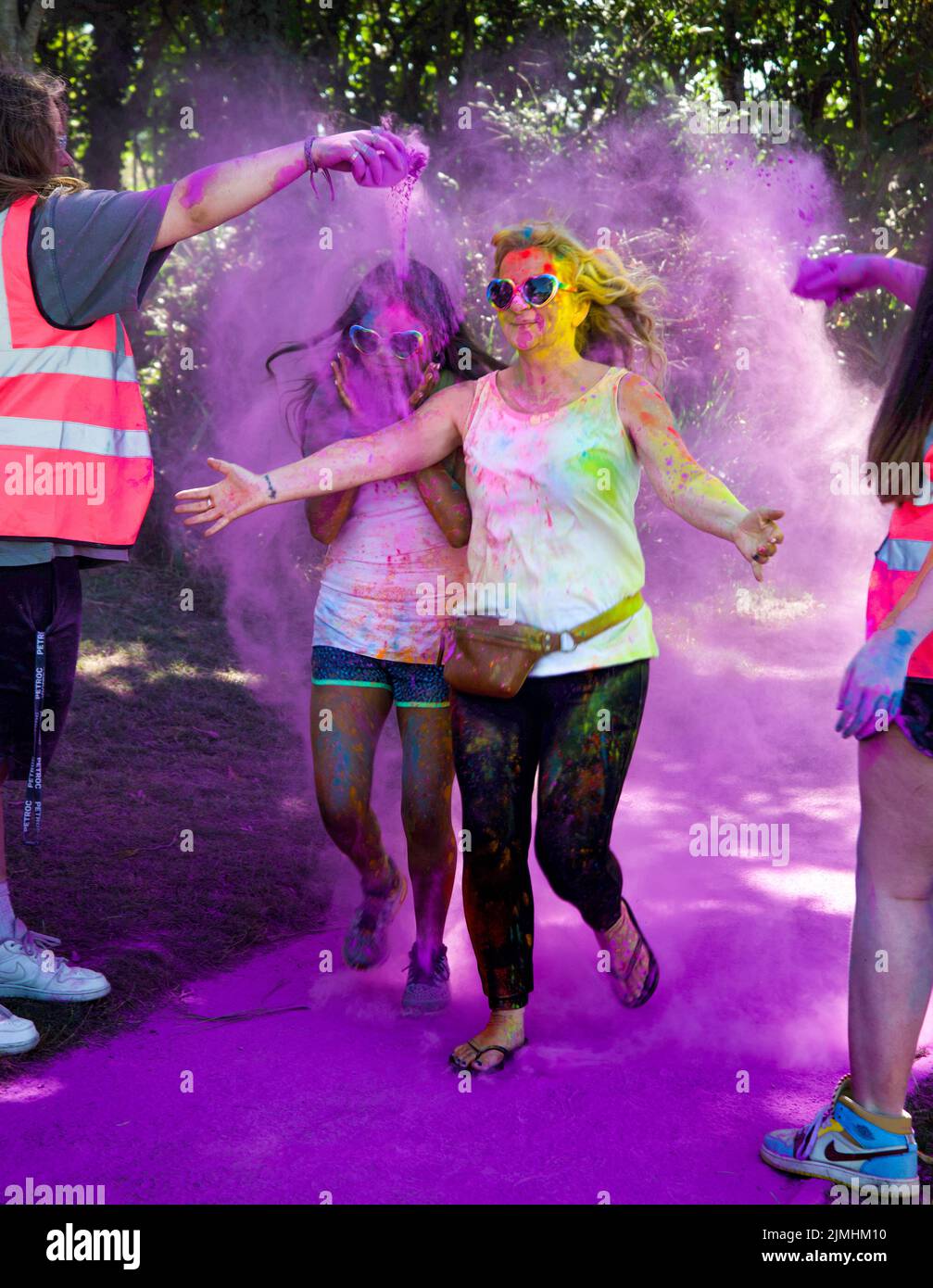 Colour fun run in a park for families Stock Photo - Alamy