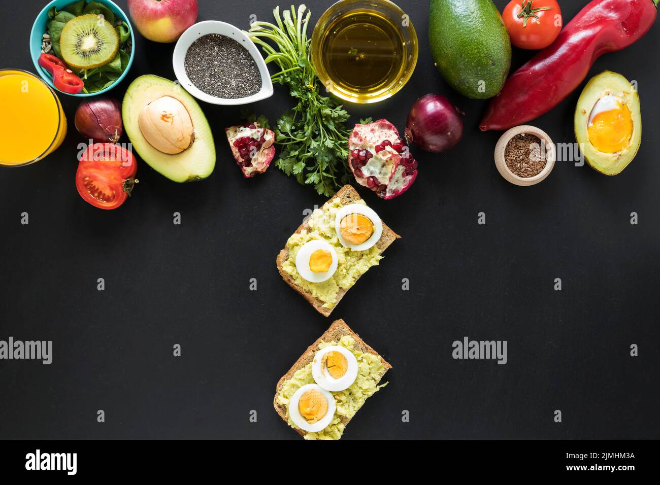 Heathy food ingredients black background Stock Photo - Alamy