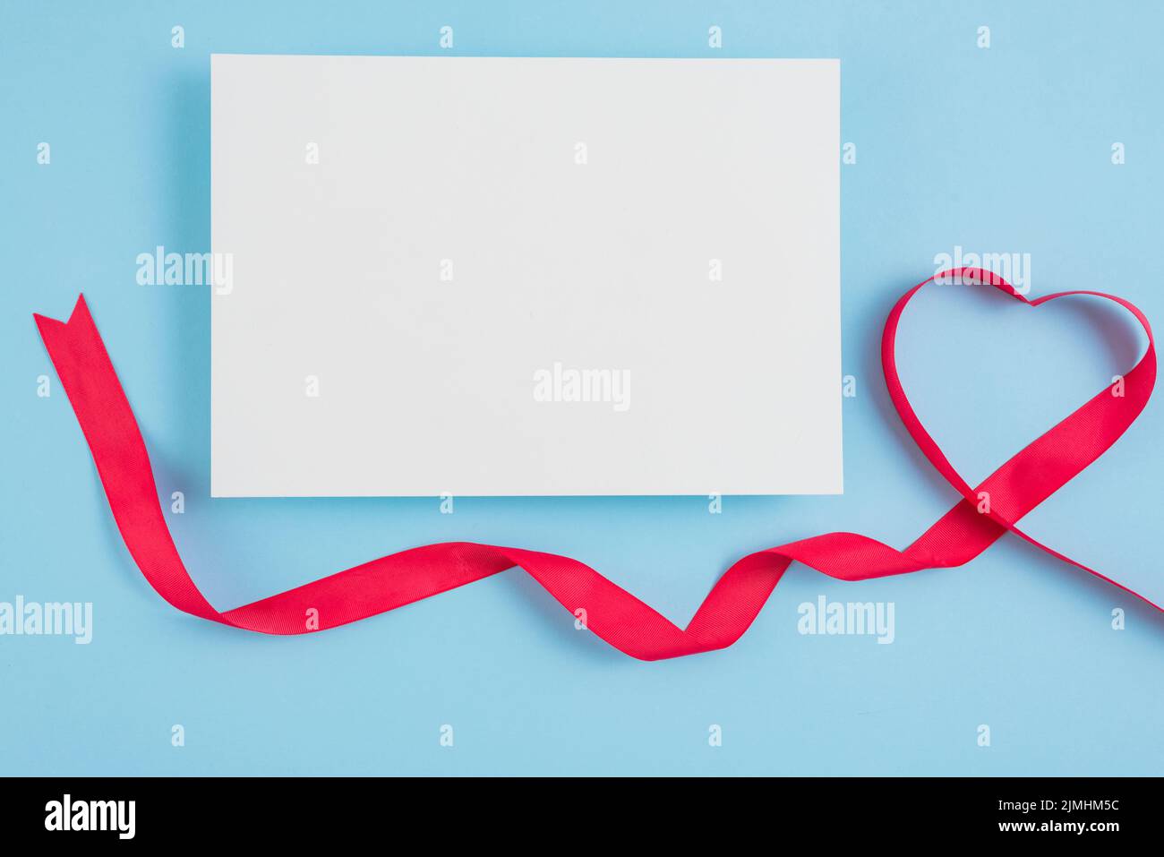 Paper near symbol heart ribbon Stock Photo - Alamy