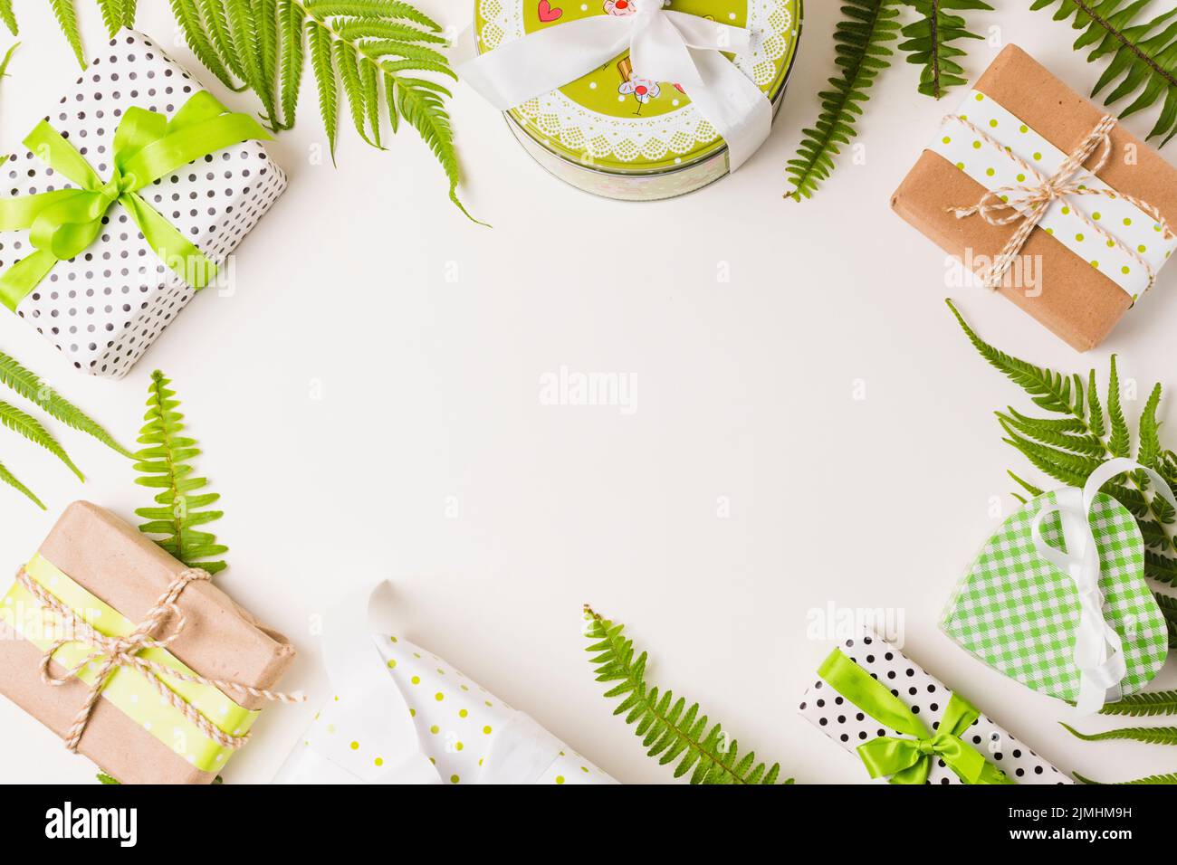 Decorative gift boxes leaves twig arranged white background Stock Photo ...