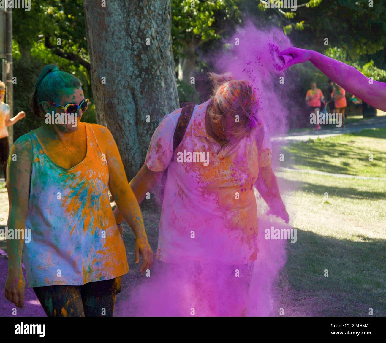 Colour fun run in a park for families Stock Photo - Alamy