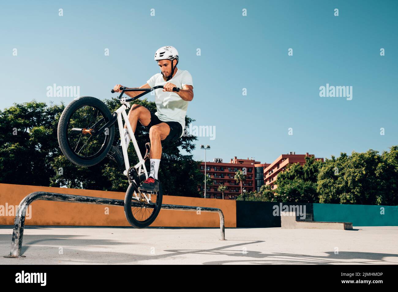Teenage bmx rider performing tricks skatepark Stock Photo - Alamy