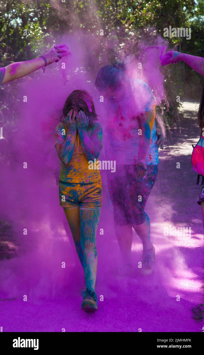 Colour fun run in a park for families Stock Photo - Alamy
