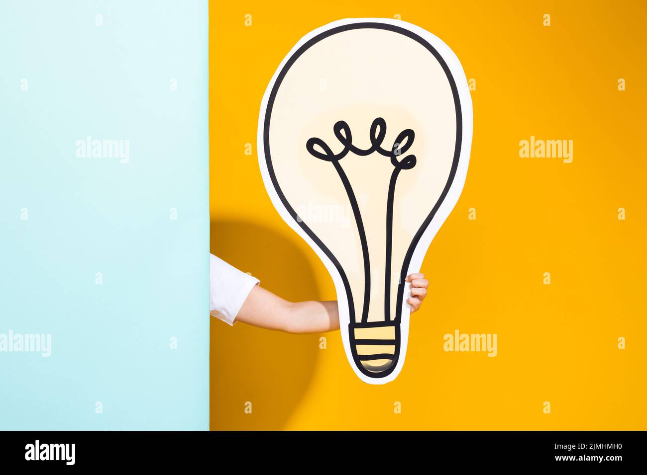 Portrait schoolgirl with big light bulb Stock Photo - Alamy