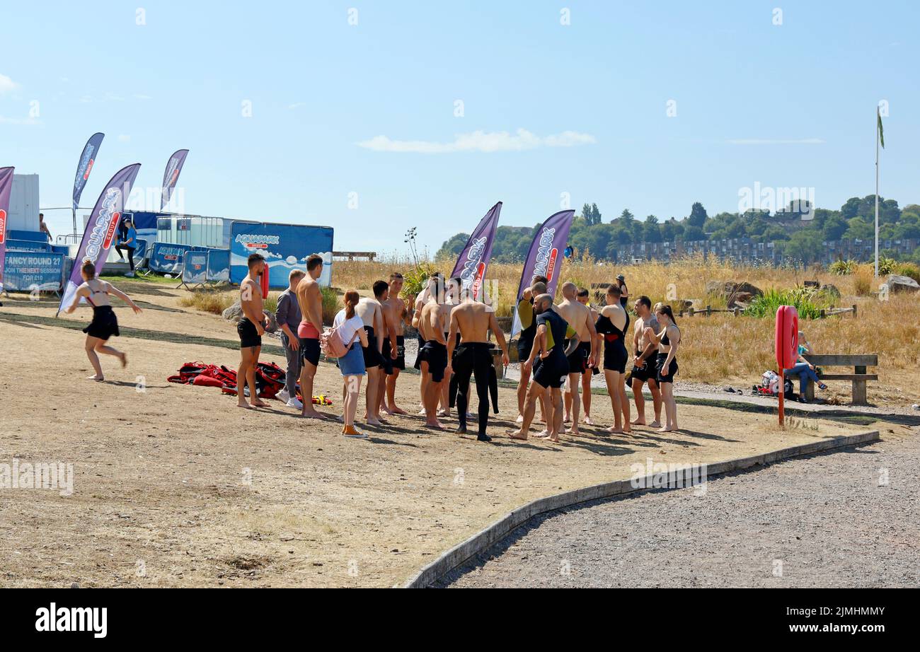 Swimmers waiting their turn at Cardiff Aqua Park inflatable obstacle ...