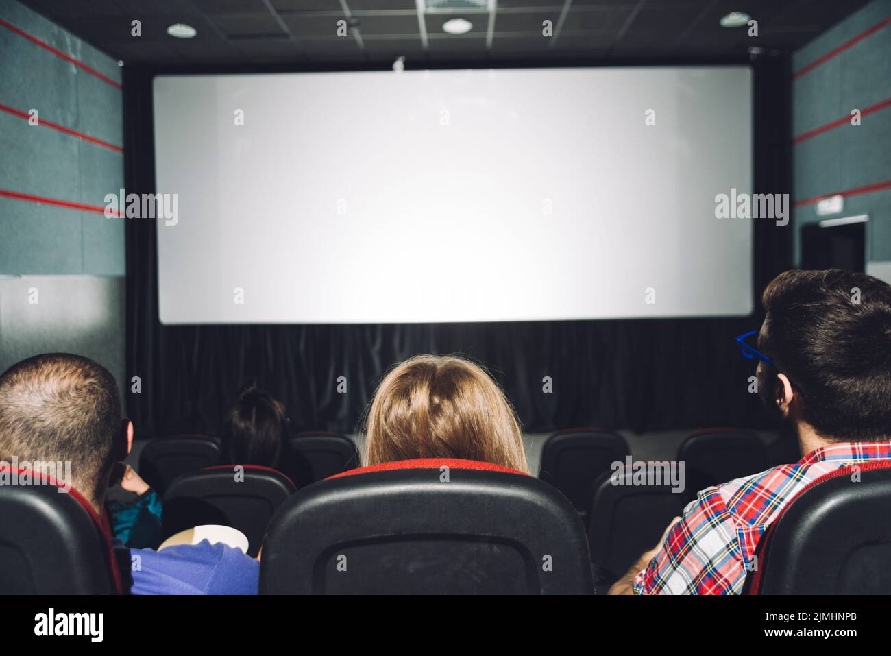 Back view people looking cinema screen Stock Photo - Alamy