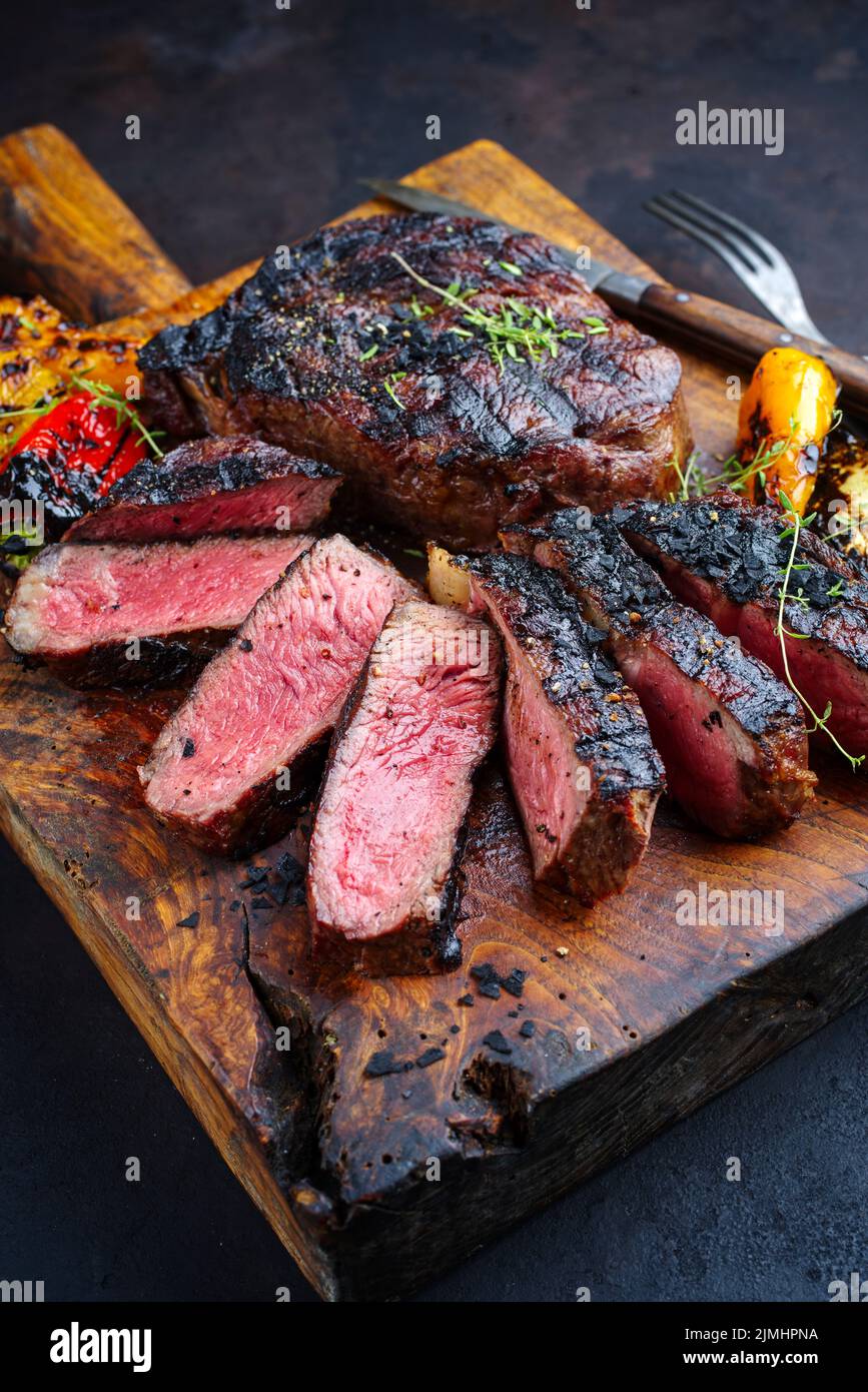 Traditional barbecue dry aged wagyu rib-eye beef steaks served with ...