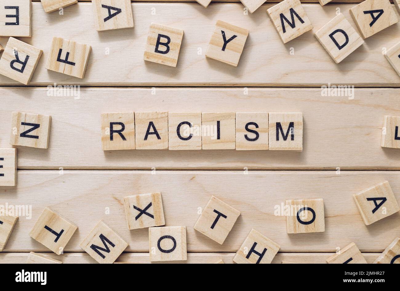 Word Racism made with letter blocks on wooden background Stock Photo ...
