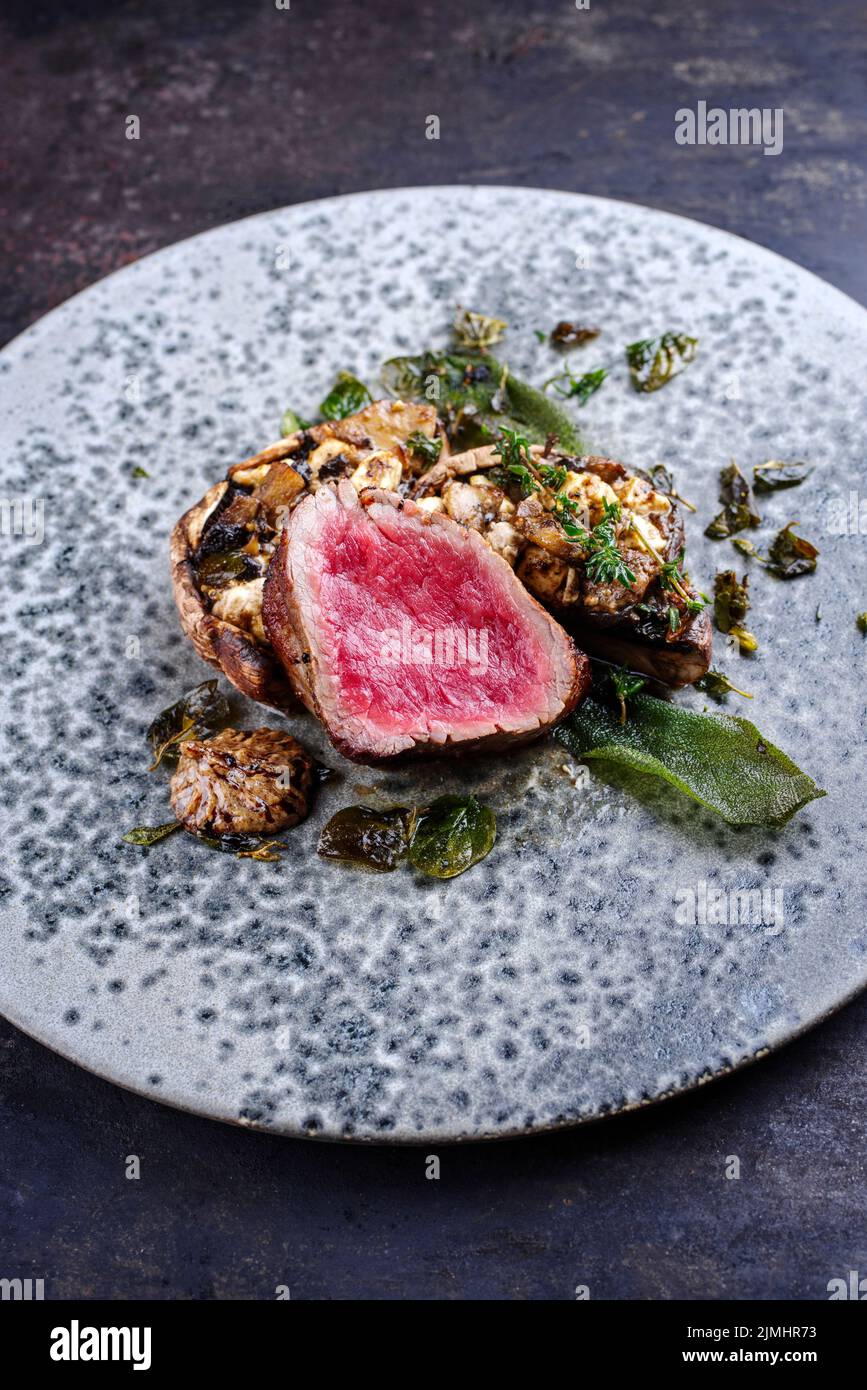 Modern style traditional fried dry aged angus beef filet medaillons ...