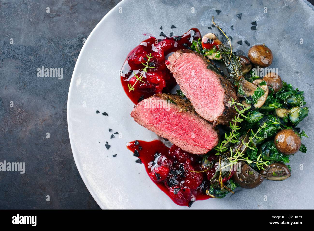 Modern style traditional fried dry aged angus beef filet medaillons ...