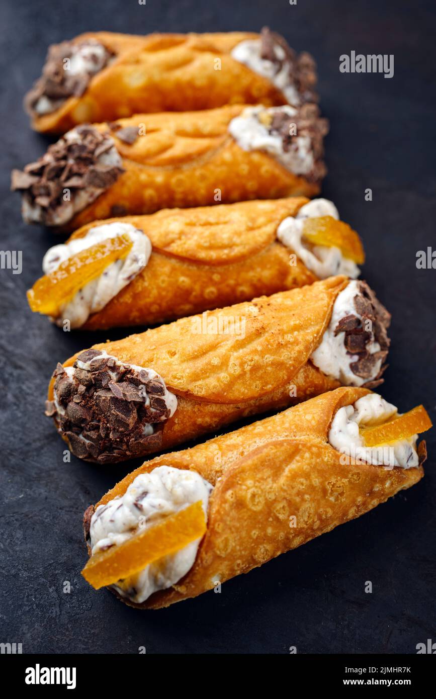 Traditional Italian Sicilian pastry dessert cannoli with creamy ricotta ...